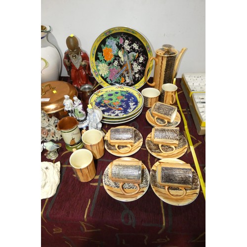 Two tall ceramic gin and whisky bottles, a large copper frying pan, a ...