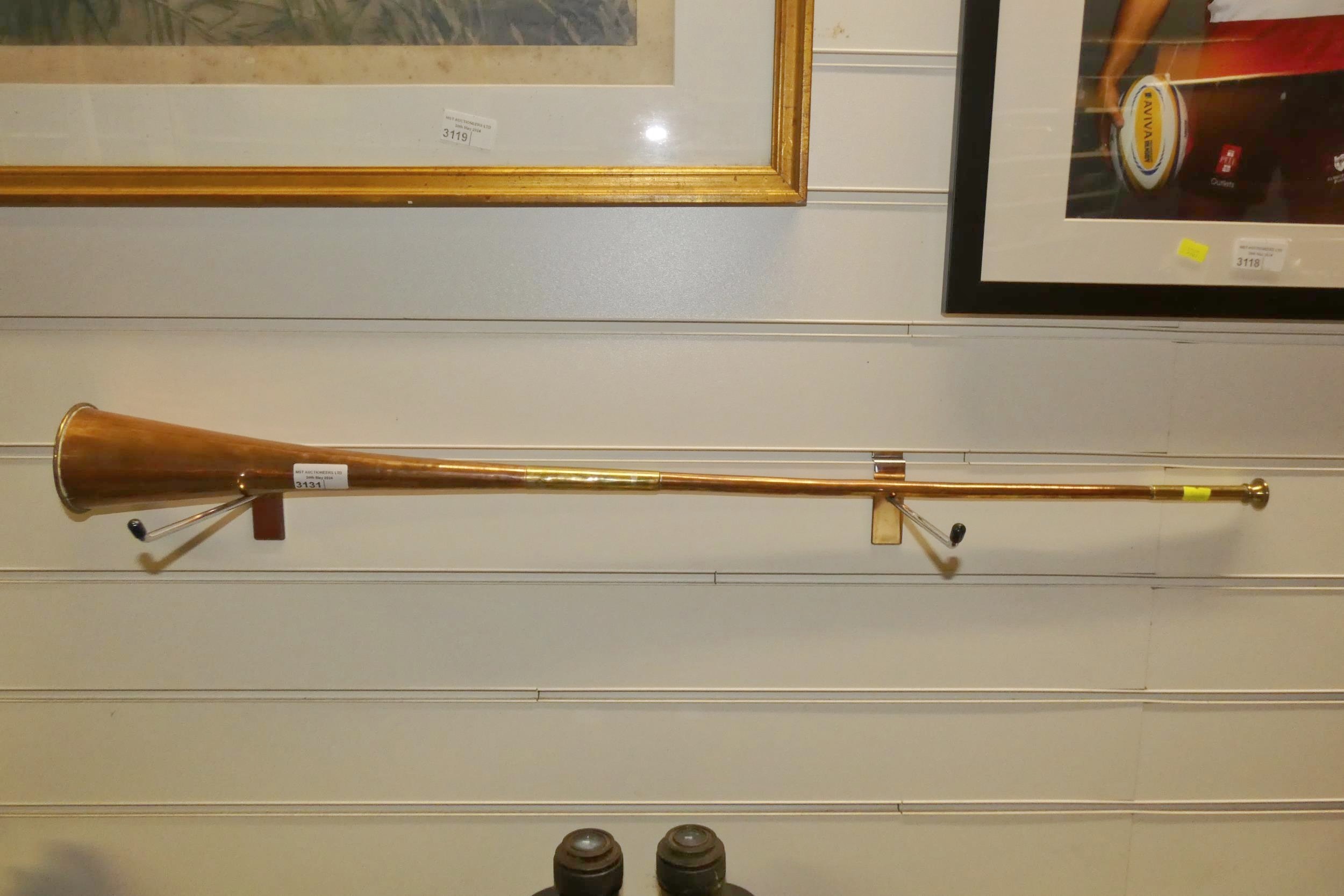 A copper coaching horn