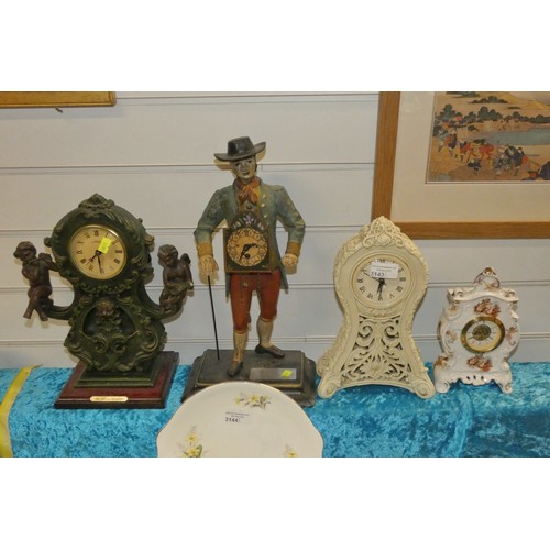 A vintage Dutch style clock peddler clock and 3 other decorative mantle ...