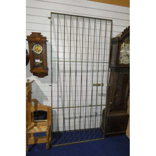 A large iron security gate, approximately 104 centimeters