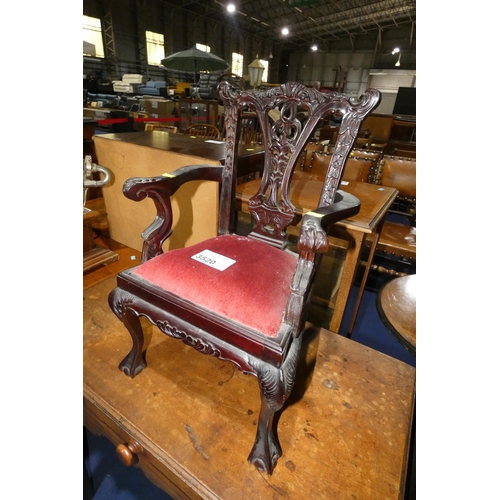A miniature carved mahogany Chippendale style carver chair on cabriole ...