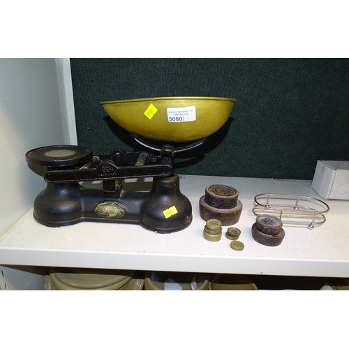 A pair of retro kitchen scales, a collection of stoneware kitchen jars ...