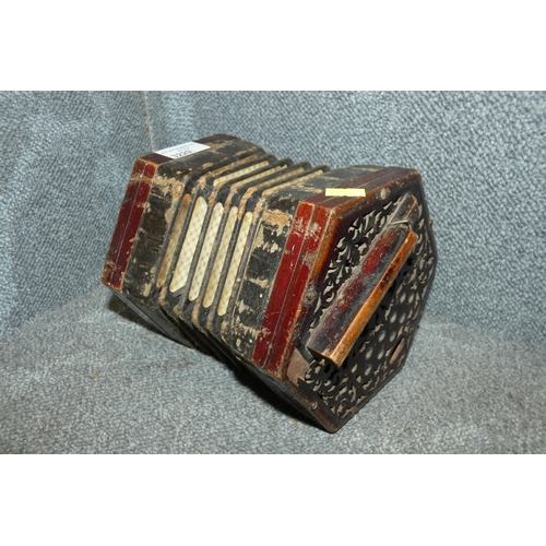 A vintage hexagonal concertina