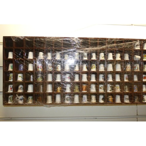 Three large wooden wall mounted display boxes containing decorative ...