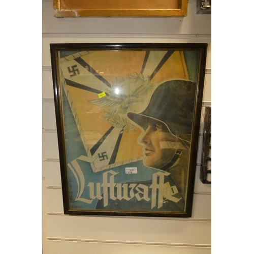 A framed Nazi war poster and a small framed collage of Nazi badges