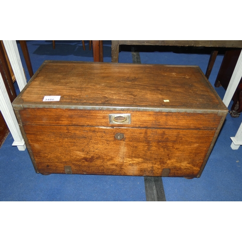 A vintage brass bound mahogany storage box with a lift lid and side handles