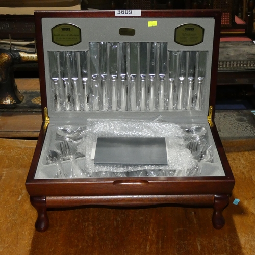 A boxed set of silver plated cutlery