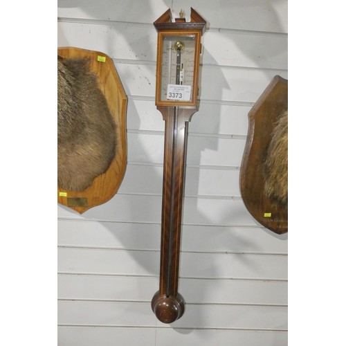 An inlaid mahogany stick barometer with Mercury tube