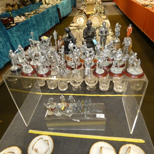 A collection of miniature white metal figurines of tradesmen and other ...