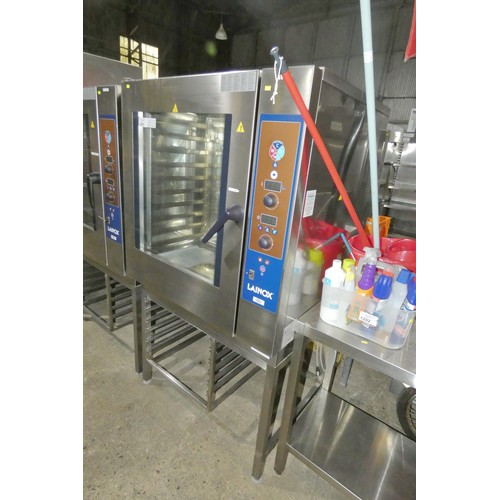 A large commercial stainless steel self cleaning Combi oven by Lainox ...