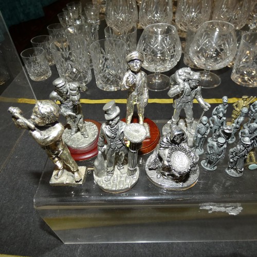 A collection of miniature white metal figurines of tradesmen and other ...