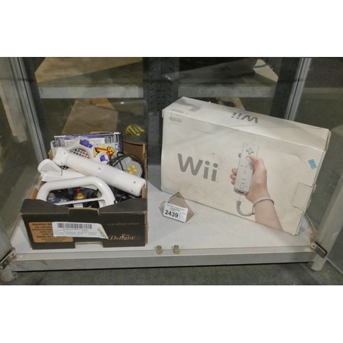 A Nintendo Wii console, boxed with Wii sports, N64 controller & 2 x ...
