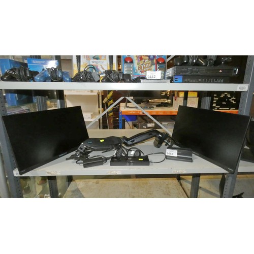 An office desk set-up including a laptop port replicator by HP, 2 x 22 ...