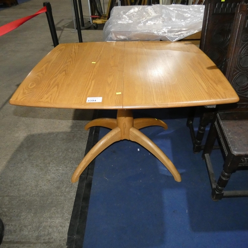 A blonde wood Ercol rectangular topped extending pedestal dining table ...