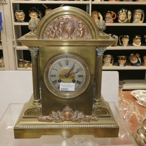 A very ornate 19th century French brass mantle clock in the ...