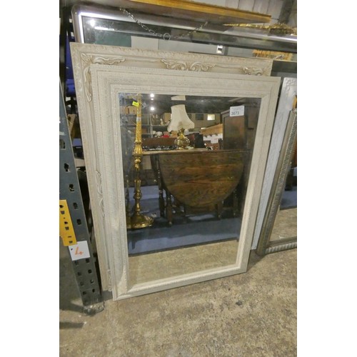 Two large rectangular wall mirrors in white decorative frames