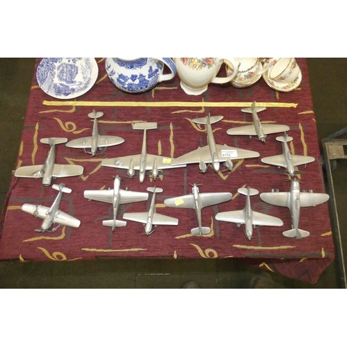 A small collection of pewter-coloured World War II model aircraft