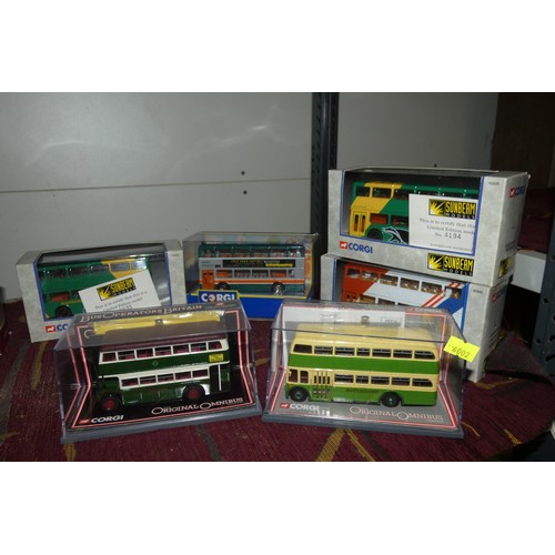 A quantity of boxed diecast model buses (two shelves)