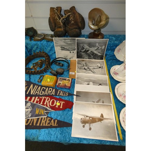 A pair of vintage boxing gloves, two pairs of vintage goggles, a ...