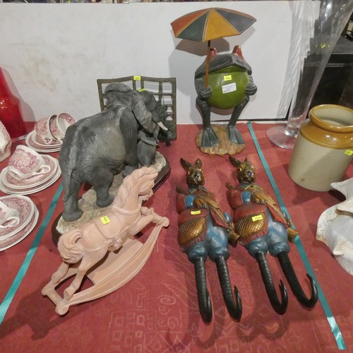 A large resin elephant with calf, a cast iron recipe stand, a large ...