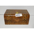 An Edwardian parquetry inlaid walnut sewing box with a lift lid