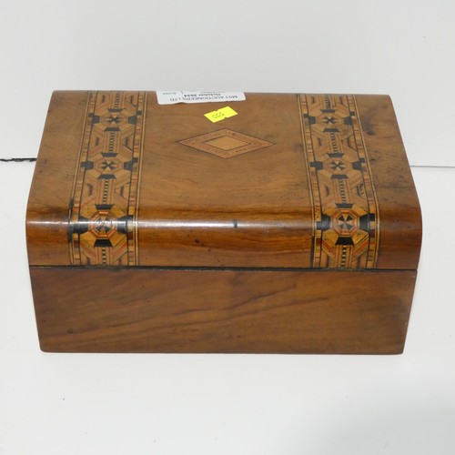 An Edwardian parquetry inlaid walnut sewing box with a lift lid