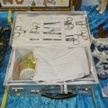 A vintage metal cased midwife's kit