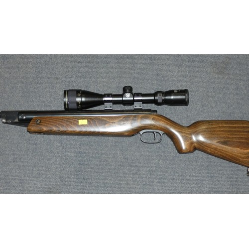A Feinwerkbau .22 air rifle with telescopic sight and noise reducer