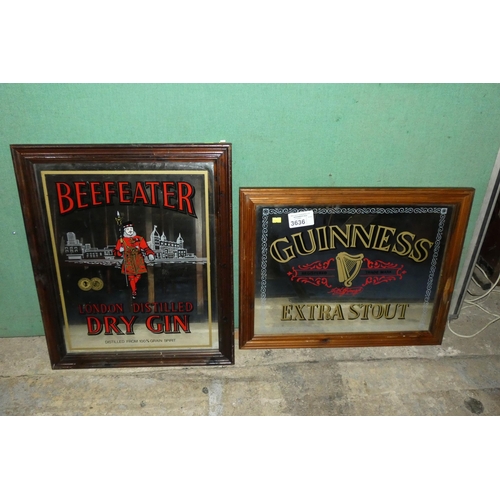 Two framed advertising mirrors