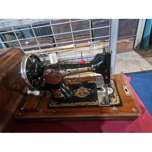 2 x vintage Frister and Rossman hand sewing machines both in wooden ...
