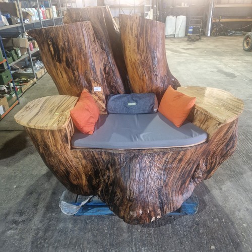 A very large log throne seat with cushions. This unusual and impressive ...