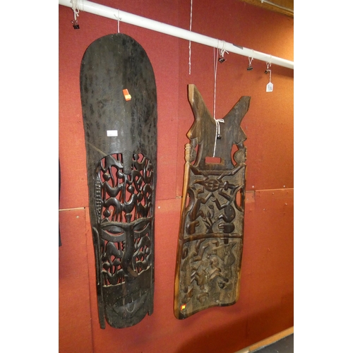 Two large carved wooden tribal wall shields