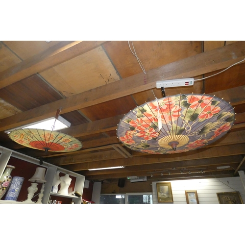 Two Japanese floral patterned paper sun parasols
