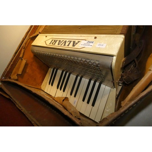 A small vintage piano accordion with carry case by Alvari
