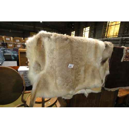 Two reindeer skin rugs