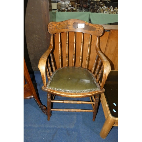 An Edwardian Oak spindle back smokers elbow chair