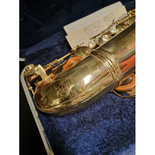 A 1970s vintage Conn tenor saxophone with carry case