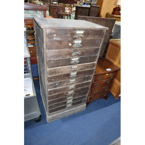 A vintage dark stained index cabinet of 12 drawers approximately 58 ...