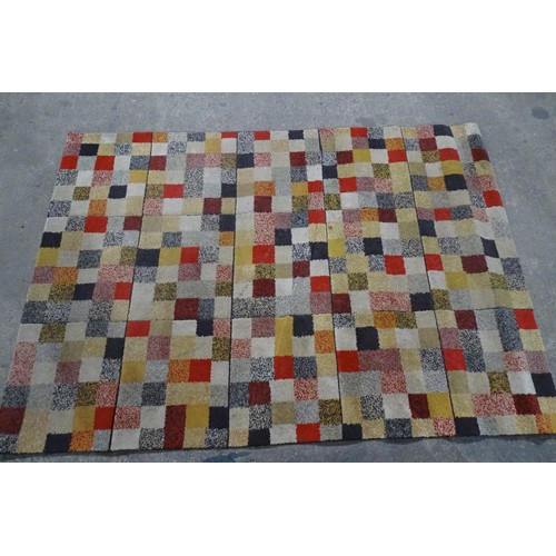 A multi-coloured patterned carpet