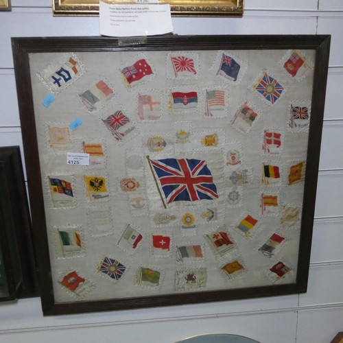 An oak framed silk collage of flags of the world approx 53cm x 52cm