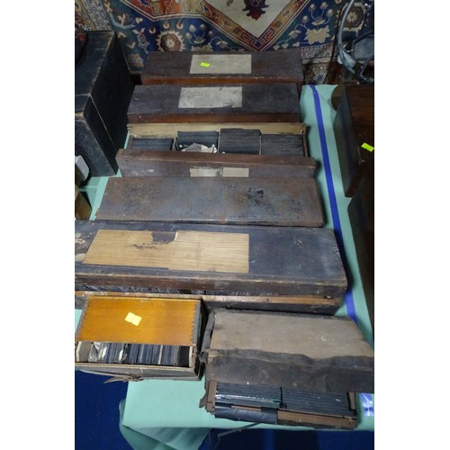 A vintage a magic lantern and quantity of glass magic lantern slides