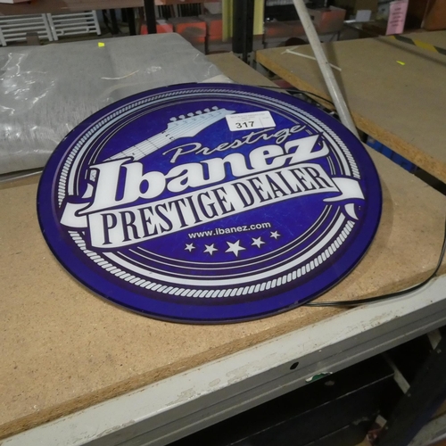 1 x Ibanez sign measuring approx 40cm across - light requires attention