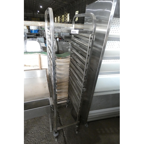 A commercial stainless steel mobile 15 tray rack approx 33x54cm trays ...