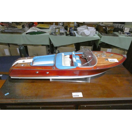 A mounted model of a luxury classic design speed boat