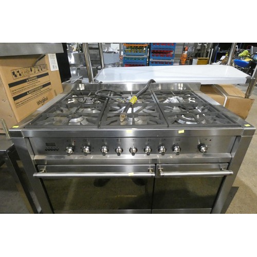 A stainless steel cooking range with 6 gas fired burners and 2 ovens ...