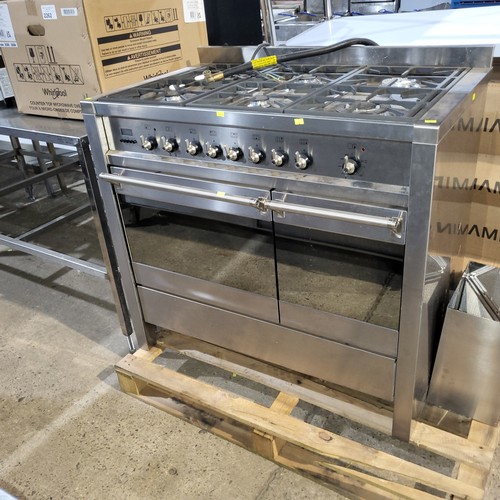 A stainless steel cooking range with 6 gas fired burners and 2 ovens ...
