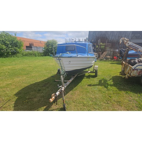 A blue & white Bonwitco-With 15ft boat including a single axle boat ...