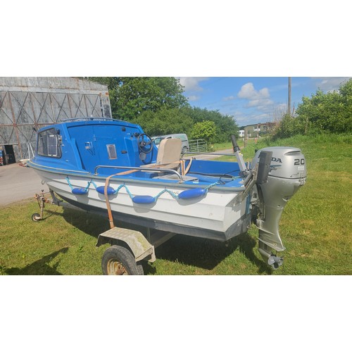 A blue & white Bonwitco-With 15ft boat including a single axle boat ...