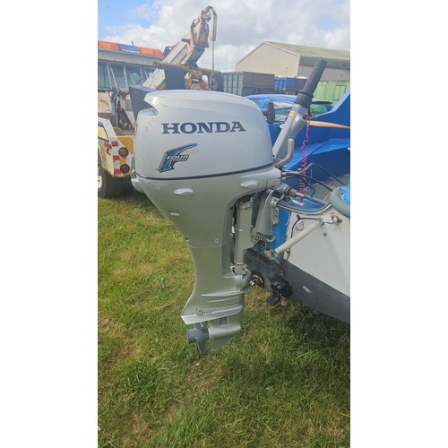 A blue & white Bonwitco-With 15ft boat including a single axle boat ...