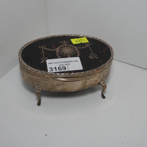 A small silver and tortoise shell decorative trinket box with a lift ...